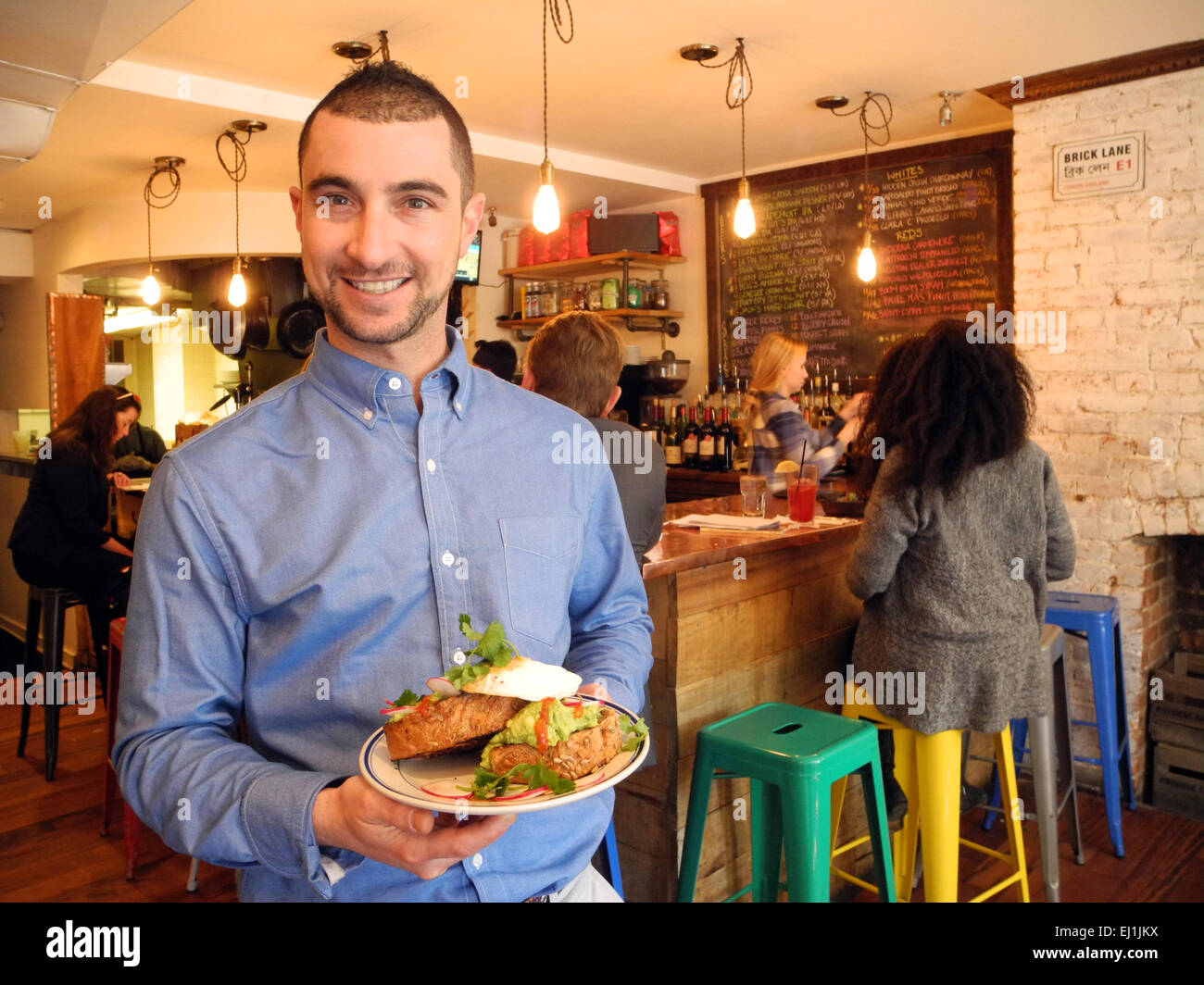 Washington, DC, USA. 12th Mar, 2015. Owner Daniel Kramer stands with ...
