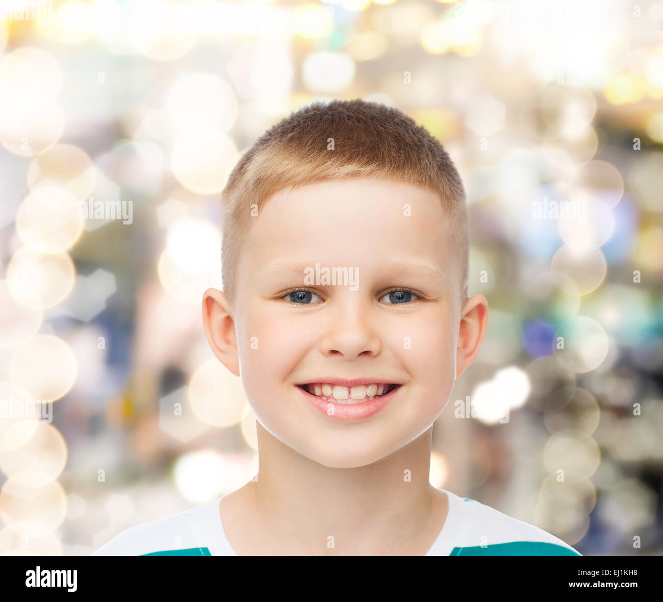 smiling little boy over sparkling background Stock Photo - Alamy