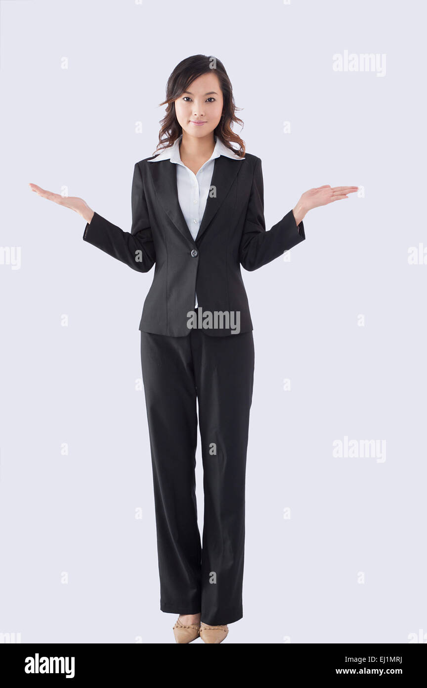 Young business woman standing and reaching hands Stock Photo - Alamy