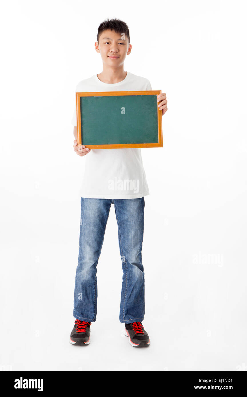 Teenage boy holding little blackboard and smiling at the camera Stock ...
