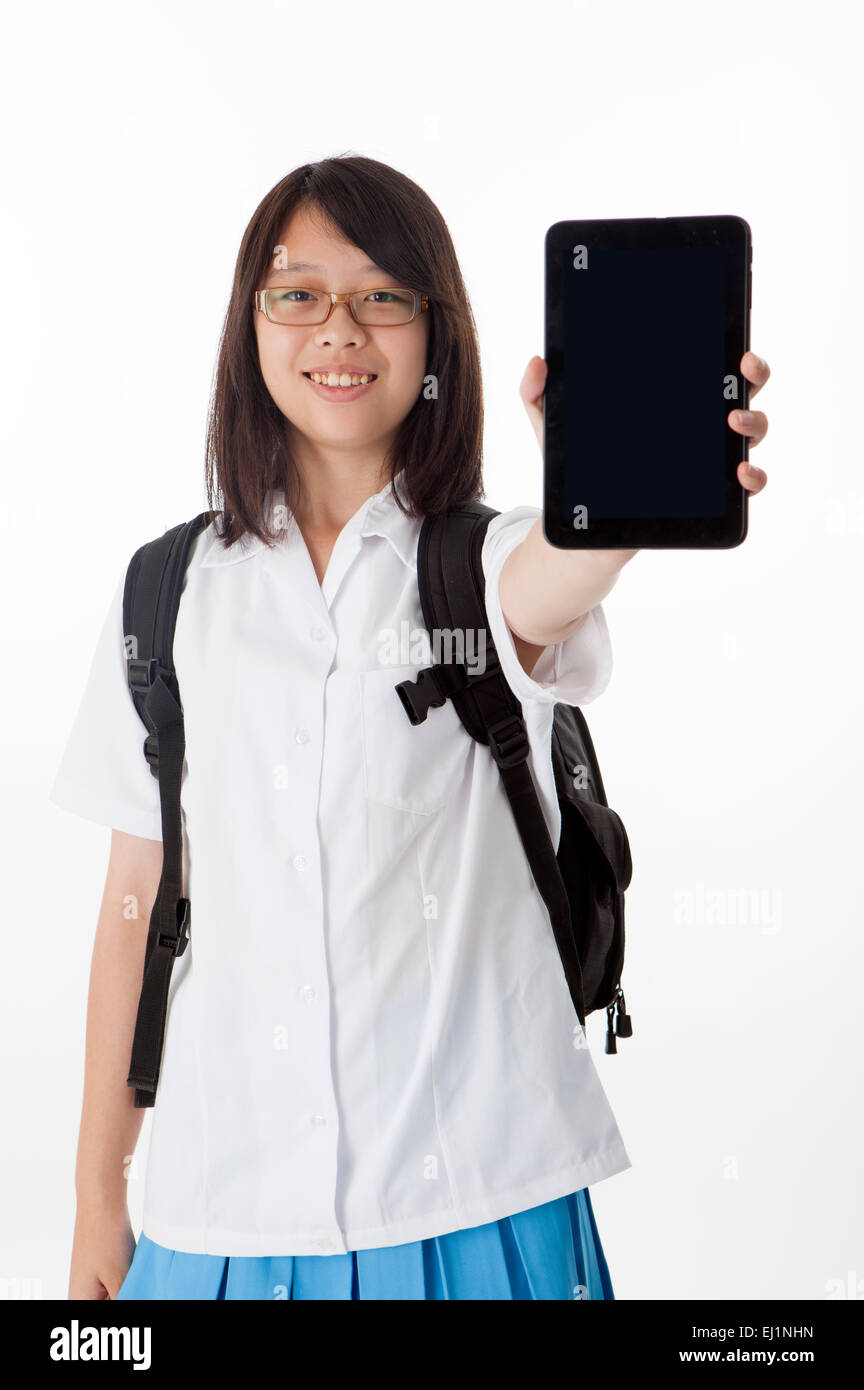 Teenage girl holding touch pad and smiling at the camera Stock Photo ...
