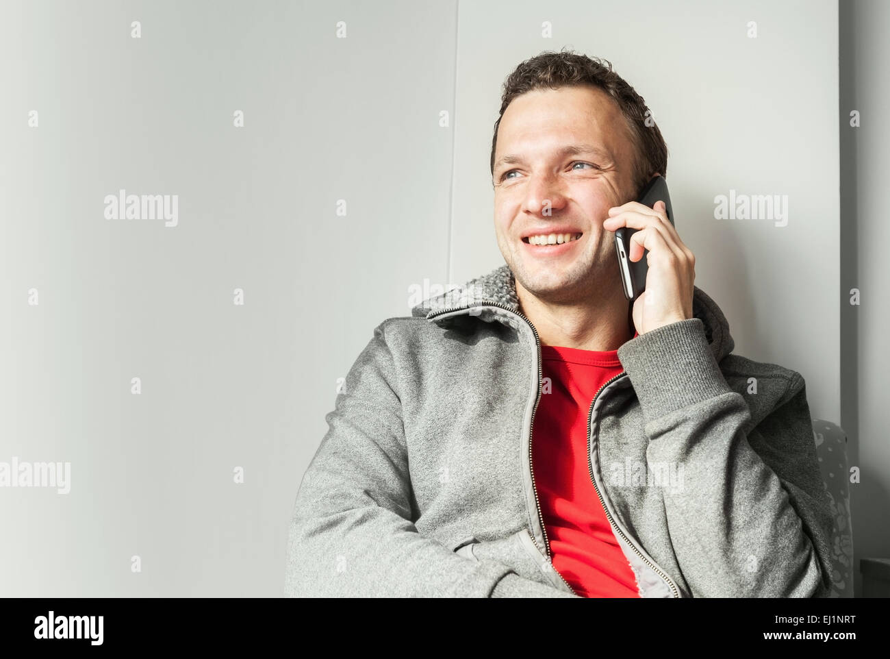 Attractive man sitting talking on hi-res stock photography and images ...
