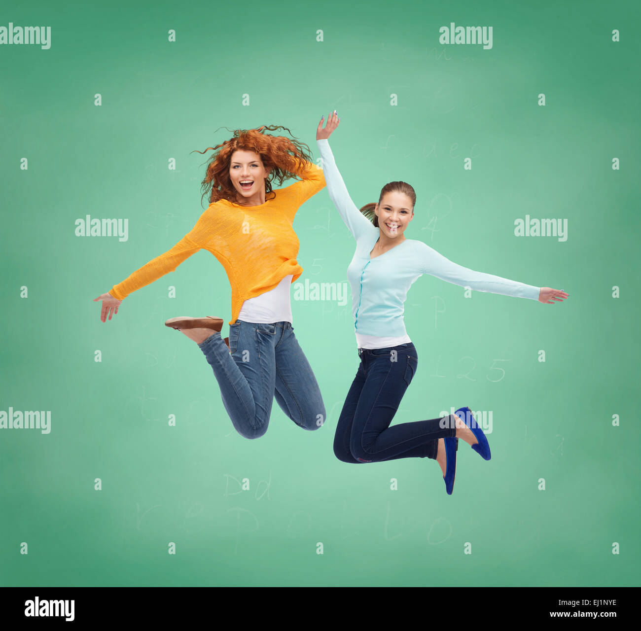 smiling young women jumping in air Stock Photo - Alamy