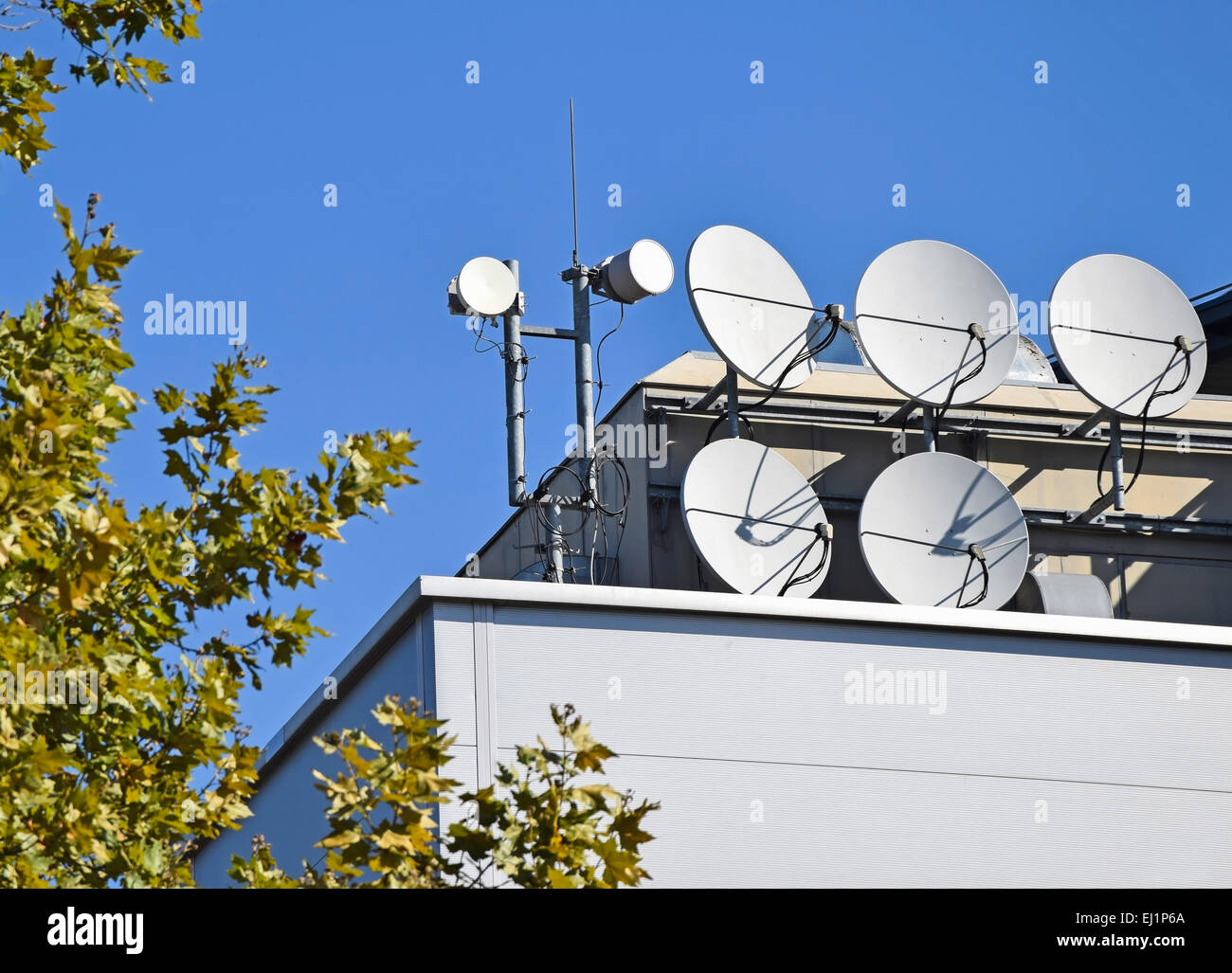 Antennas on the top of a building Stock Photo - Alamy