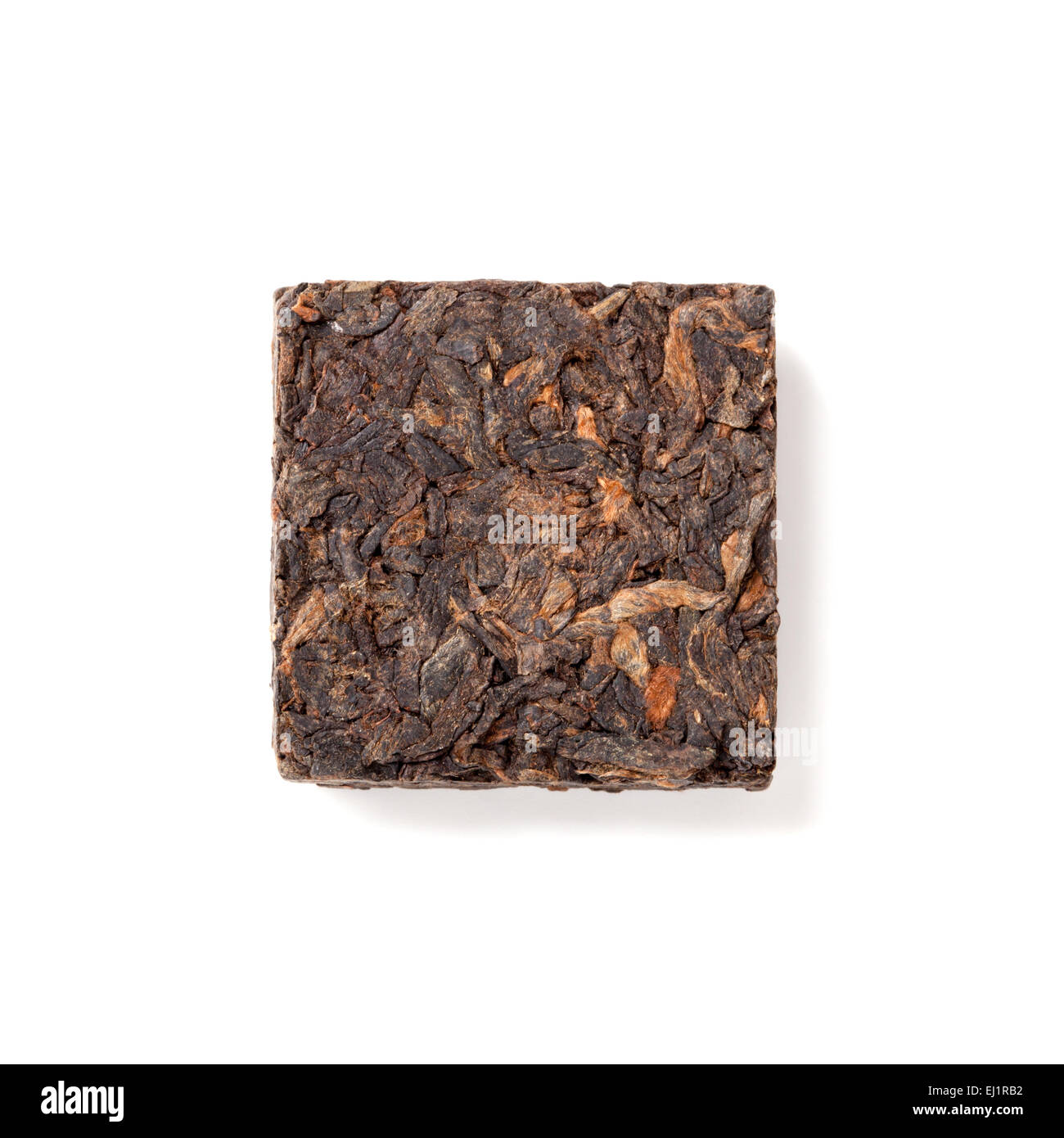 Small pressing briquette of black Chinese Shu Pu-erh tea isolated on ...