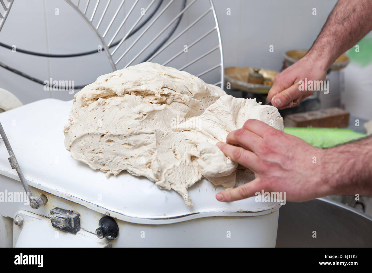 Cutting dough for bread. Manufacturing process of spanish bread Stock ...