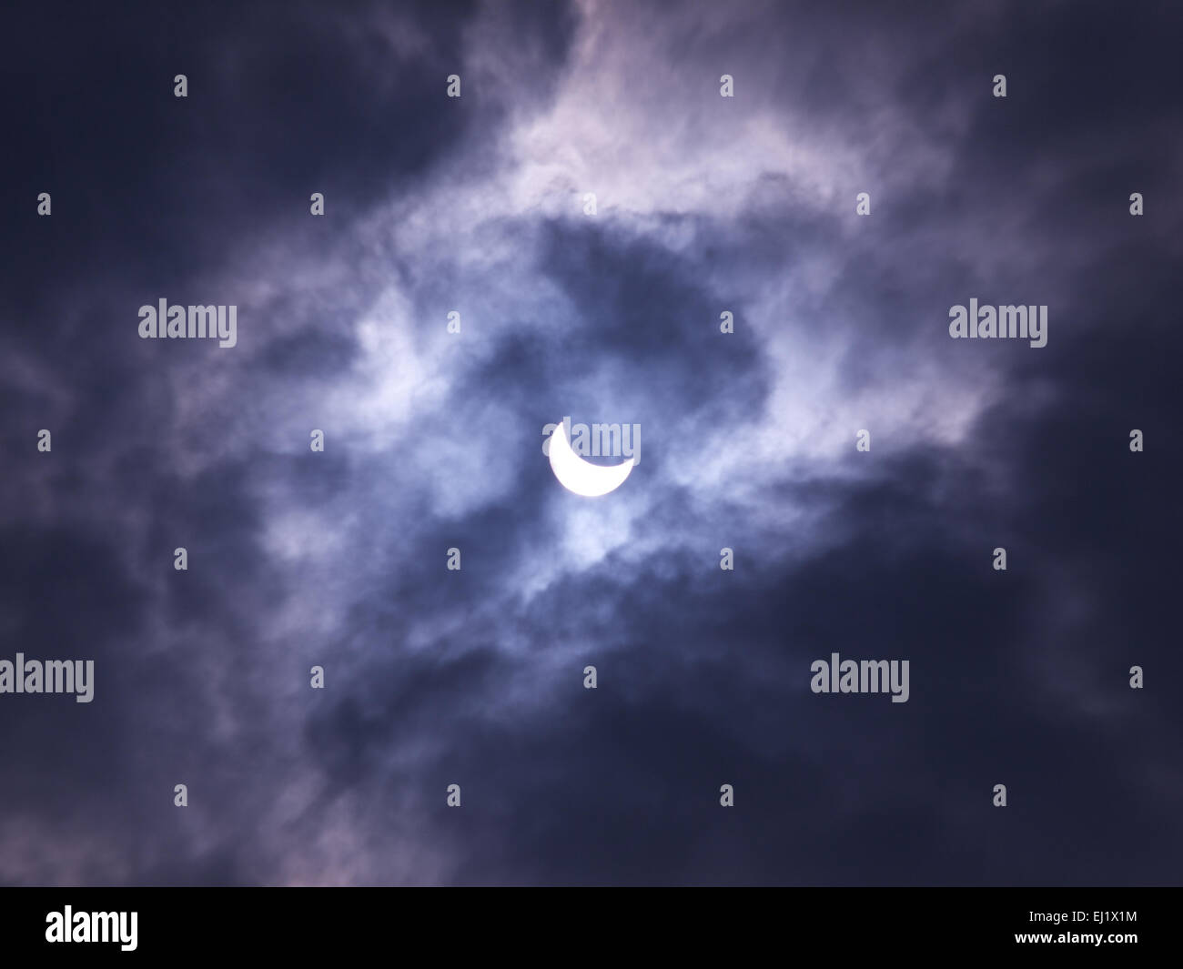 Solar eclipse 2015 in Parma (Italy). The sun is partially covered by ...