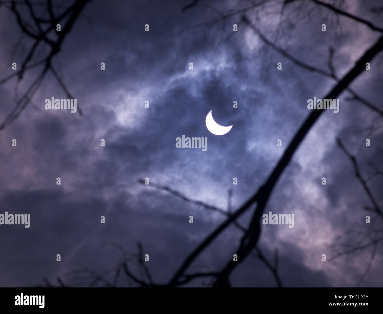 Solar eclipse 2015 in Parma (Italy). The sun is partially covered by ...