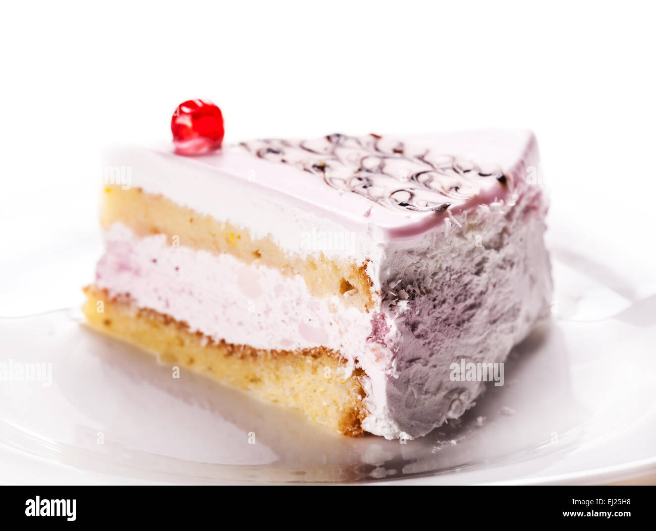 vanilla slice of cake closeup on a white background Stock Photo - Alamy