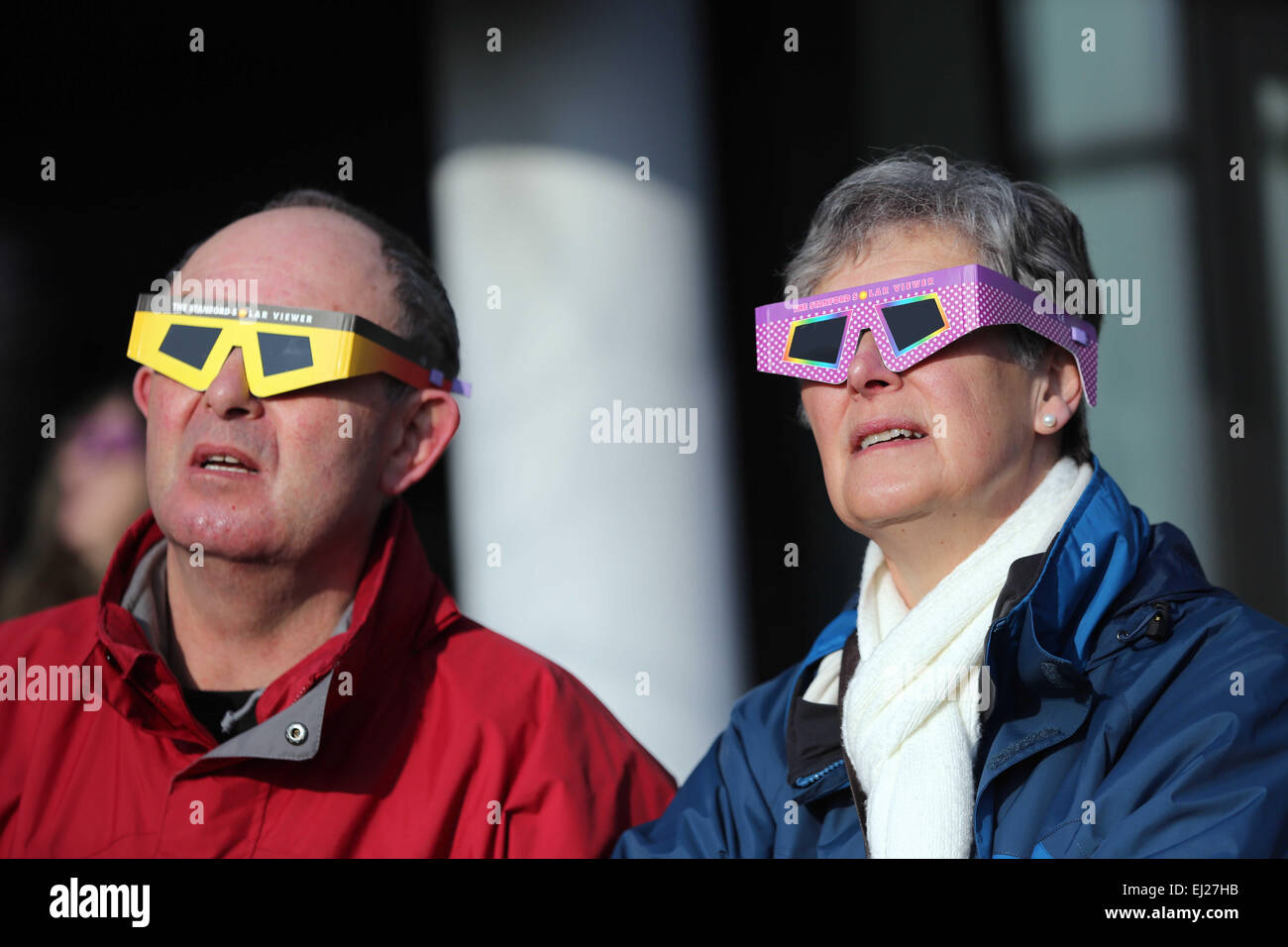 Pictured: A man and a woman watch the solar eclipse from the Waterfront ...