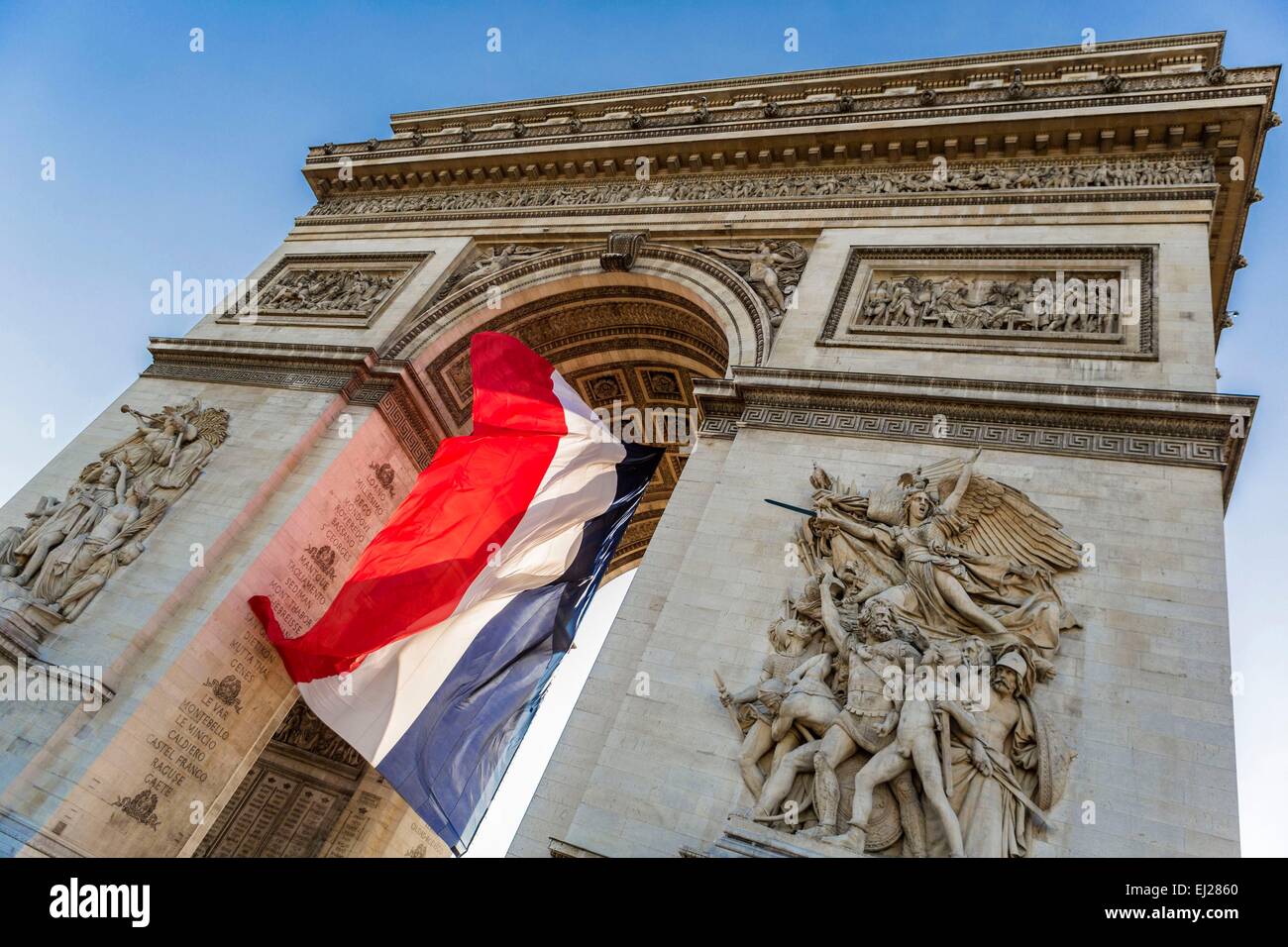 France, Paris, the French flag under the Arc de Triomphe Stock Photo ...