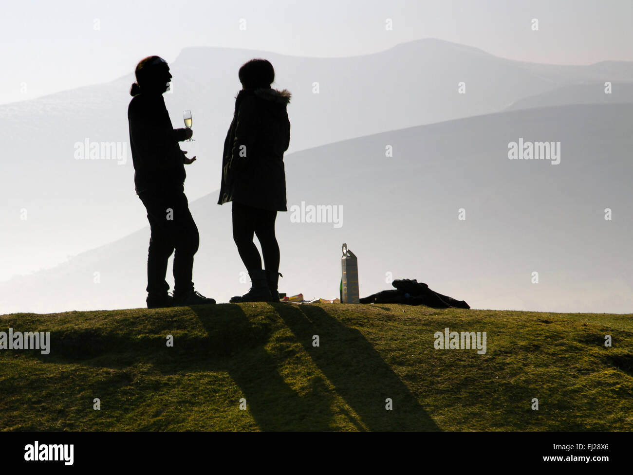 Happy couple in bright spring sunshine in Brecon Beacons in Wales ...