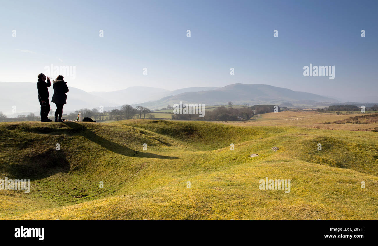 Happy couple in bright spring sunshine in Brecon Beacons in Wales ...