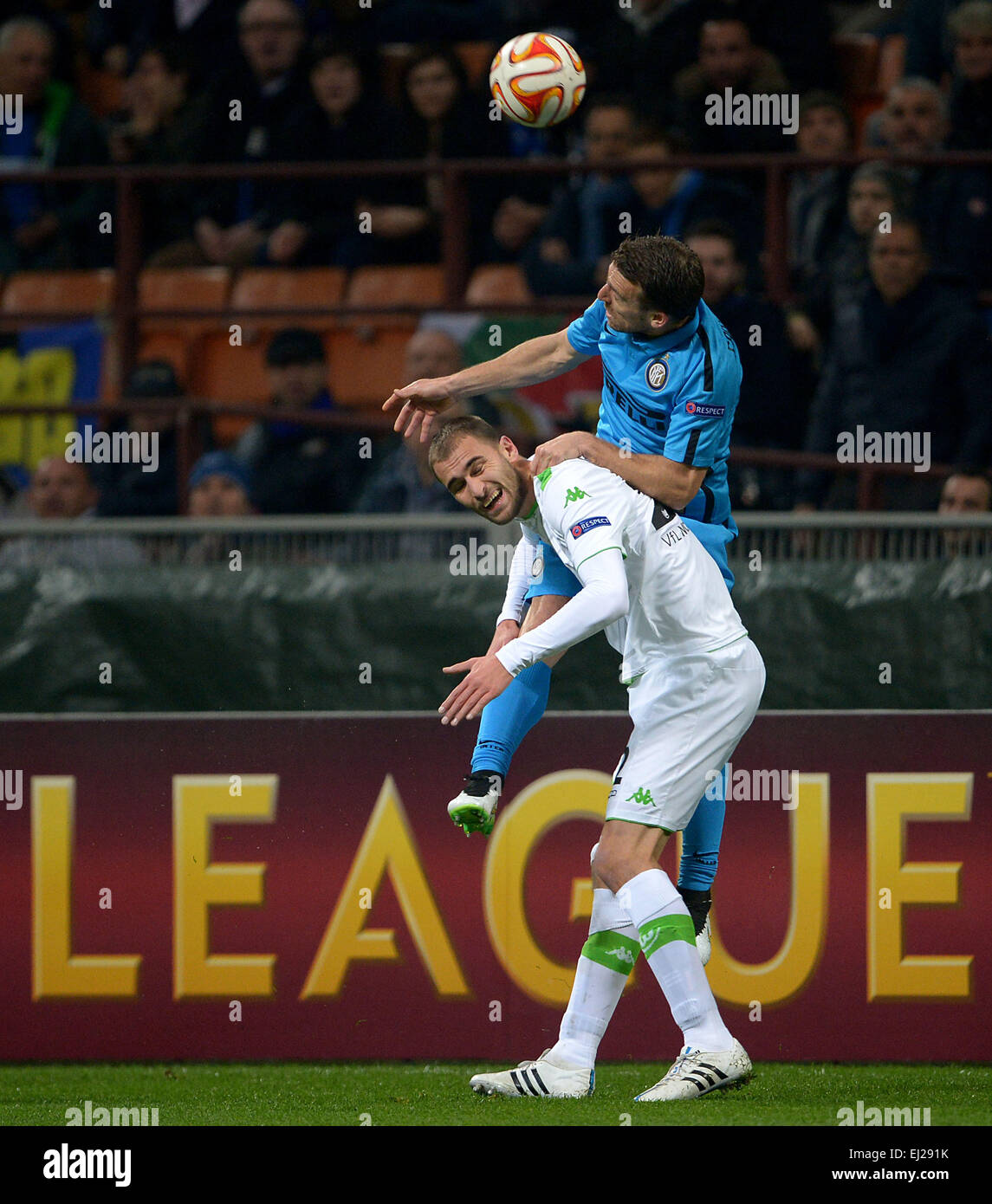 Milan, Italy. 19th Mar, 2015. Wolfsburg's Bas Dost (L) and Inter's Hugo ...