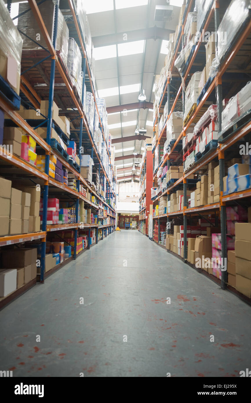 Shelves with boxes in warehouse Stock Photo - Alamy
