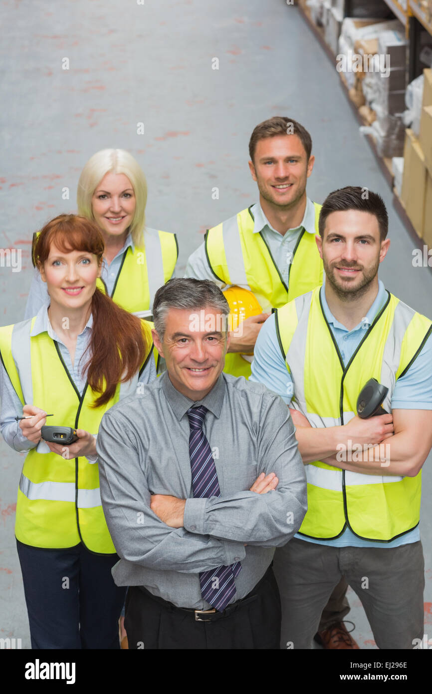 Team standing behind their boss Stock Photo - Alamy