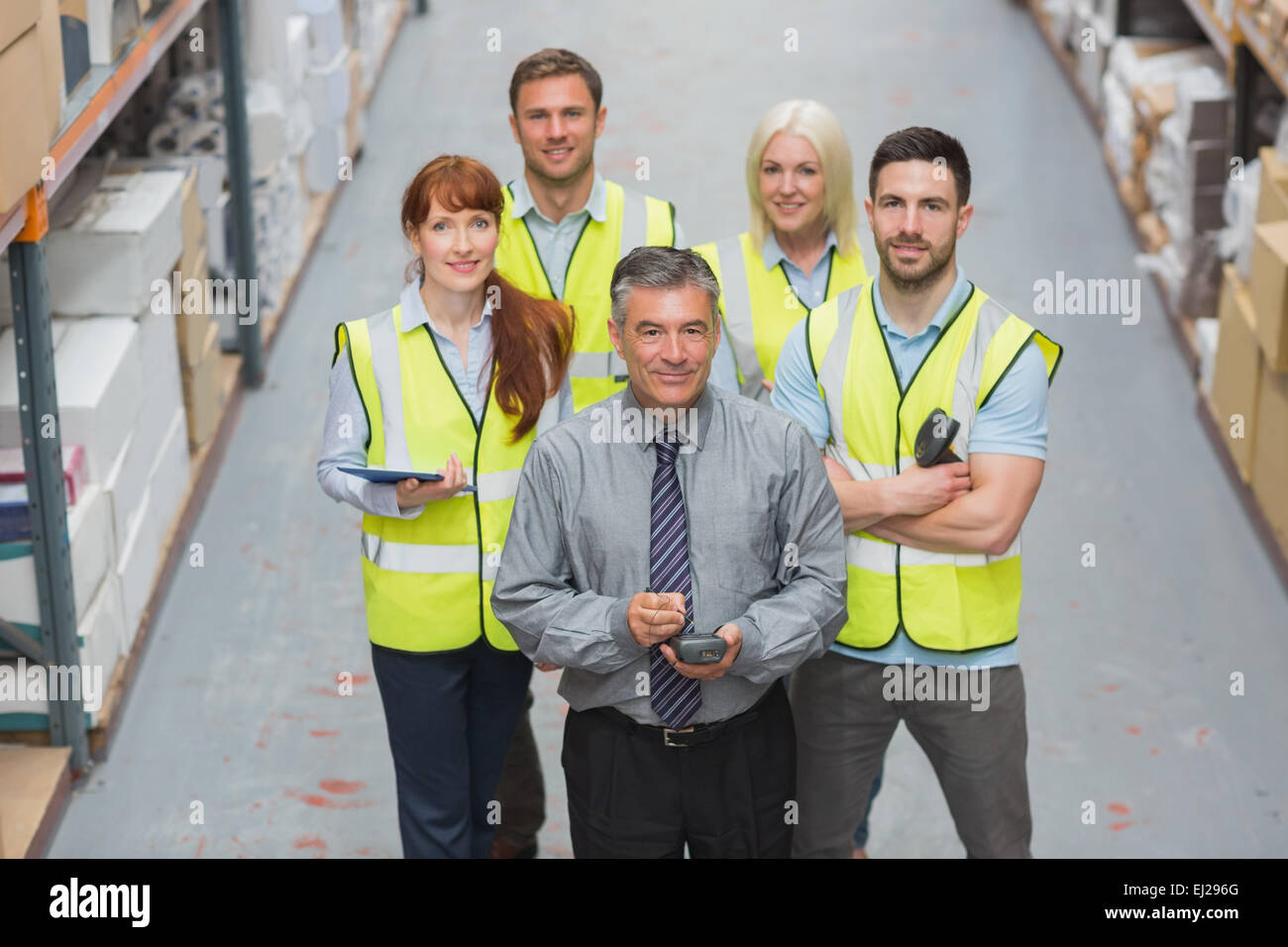 Team standing behind their boss Stock Photo - Alamy