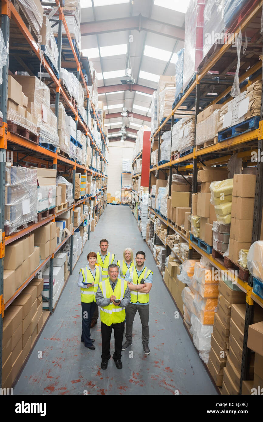 Happy business team warehouse hi-res stock photography and images - Alamy