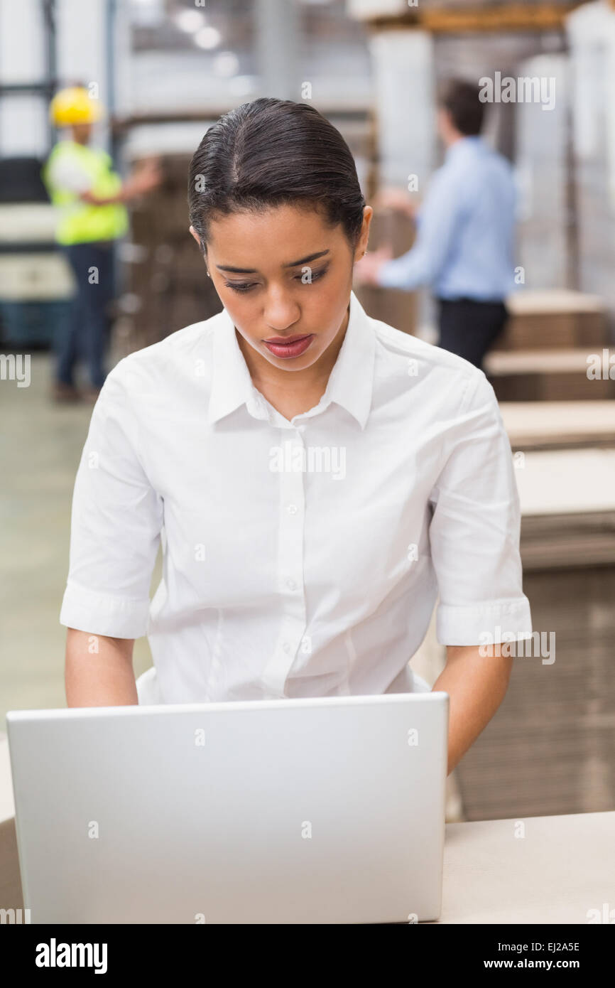 Focused manager using her laptop Stock Photo - Alamy