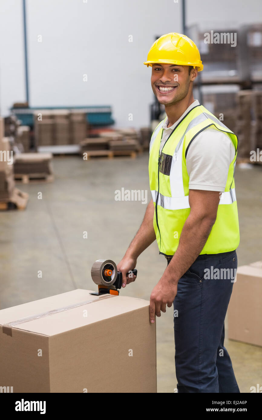 Worker preparing goods for dispatch Stock Photo - Alamy