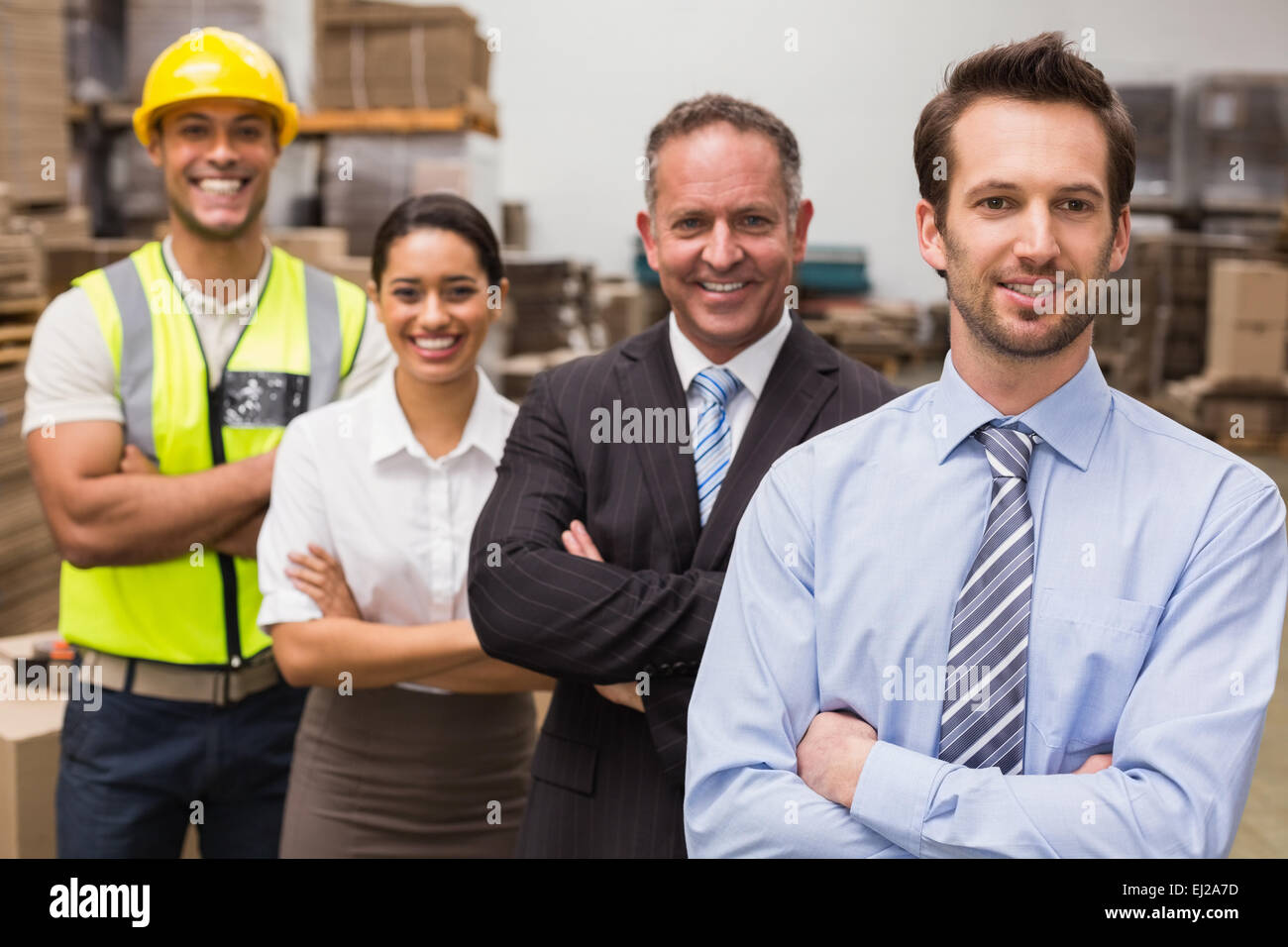 Portrait warehouse team standing arms hi-res stock photography and ...
