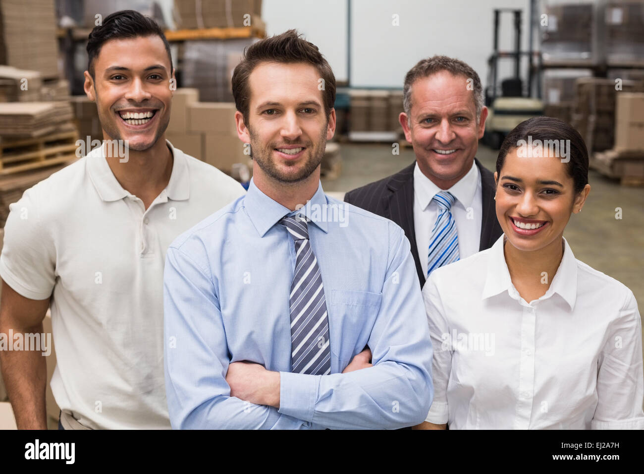 Portrait warehouse team standing arms hi-res stock photography and ...