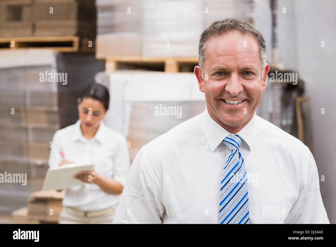 Handsome warehouse smiling camera hi-res stock photography and images ...