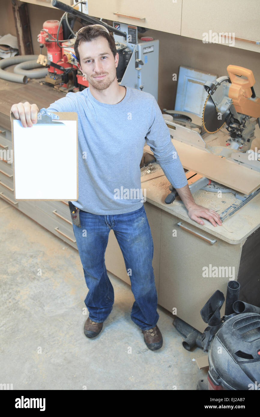 A Carpenter working hard at the shop Stock Photo - Alamy