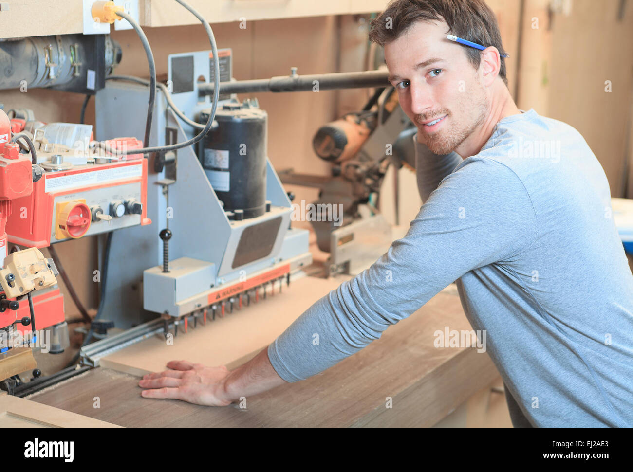 Carpenter working hard at the workshop Stock Photo - Alamy