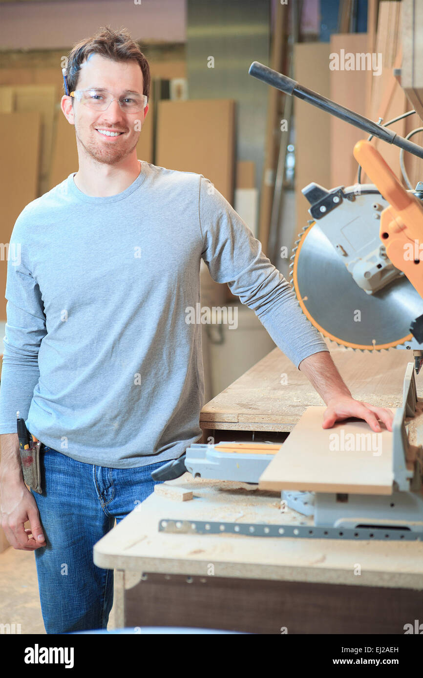 A Carpenter working hard at the shop Stock Photo - Alamy