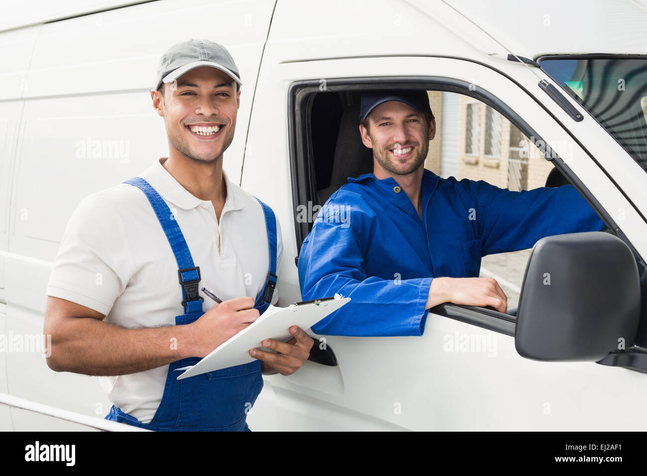 Customer signing delivery from courier hi-res stock photography and ...