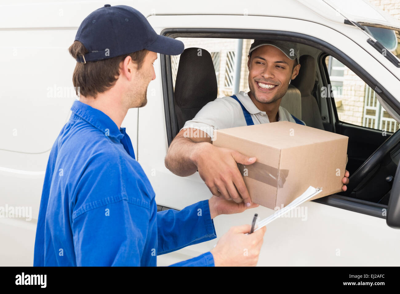 Delivery driver handing hi-res stock photography and images - Alamy