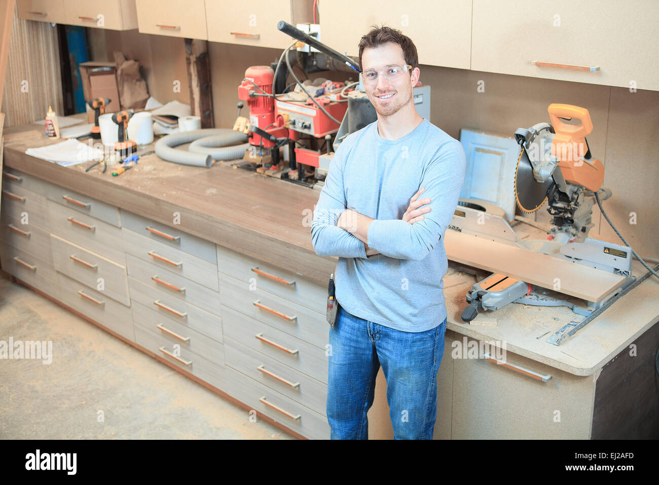 A Carpenter working hard at the shop Stock Photo - Alamy