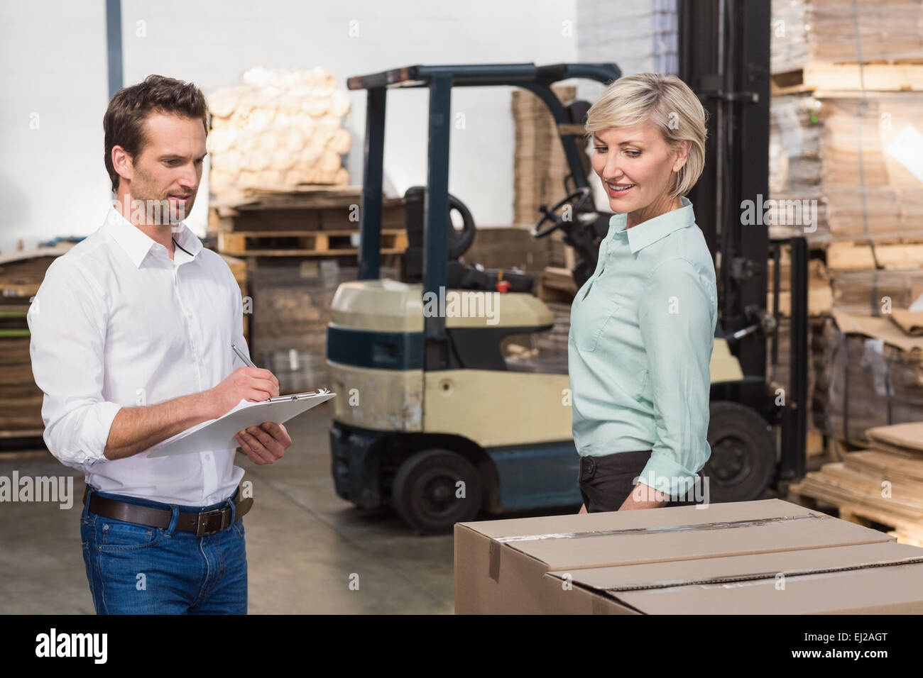 Two warehouse managers checking inventory Stock Photo - Alamy