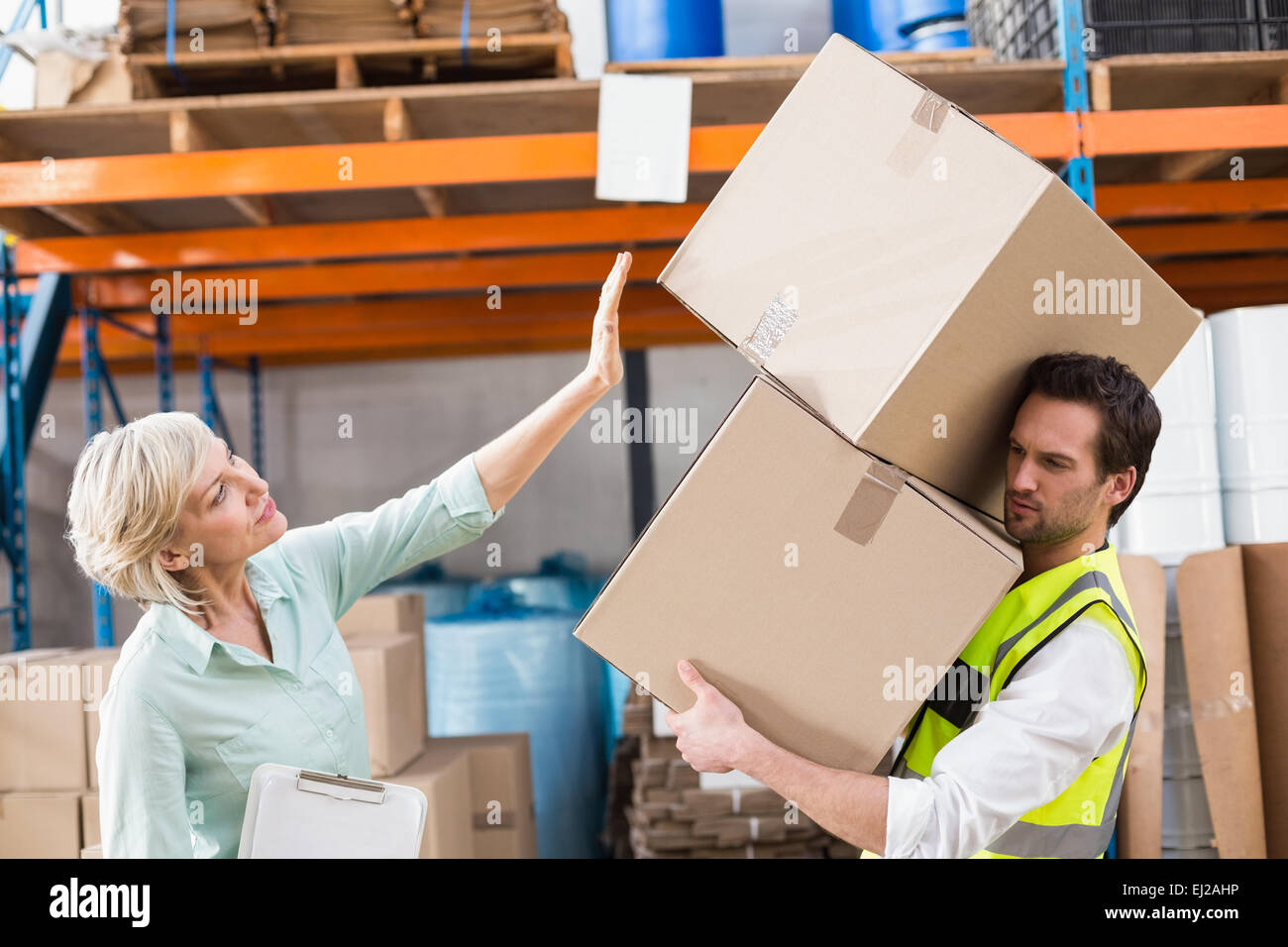 Woman carrying heavy boxes hi-res stock photography and images - Alamy