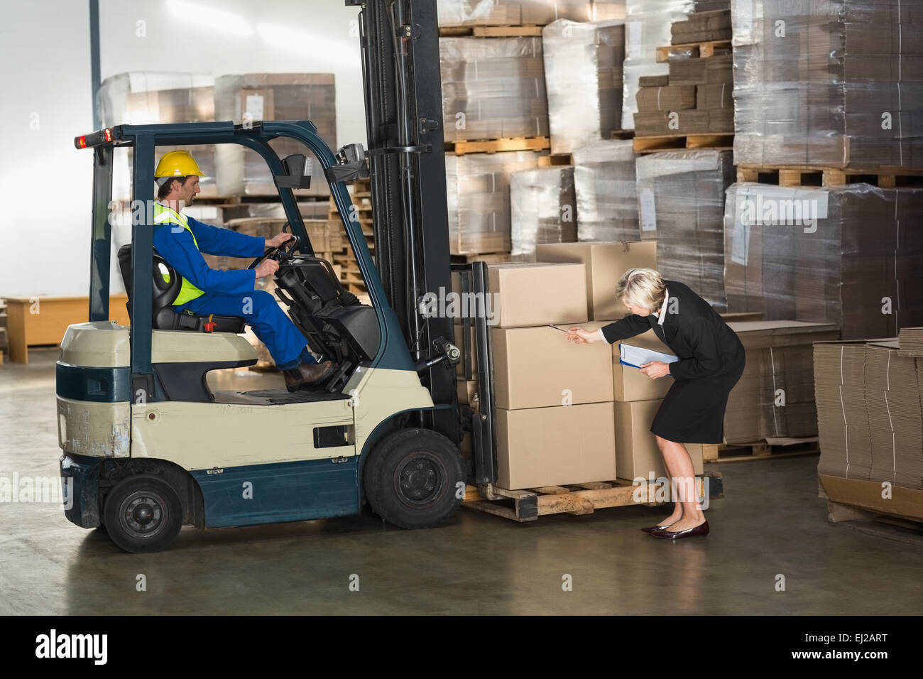 Warehouse manager checking her inventory Stock Photo - Alamy