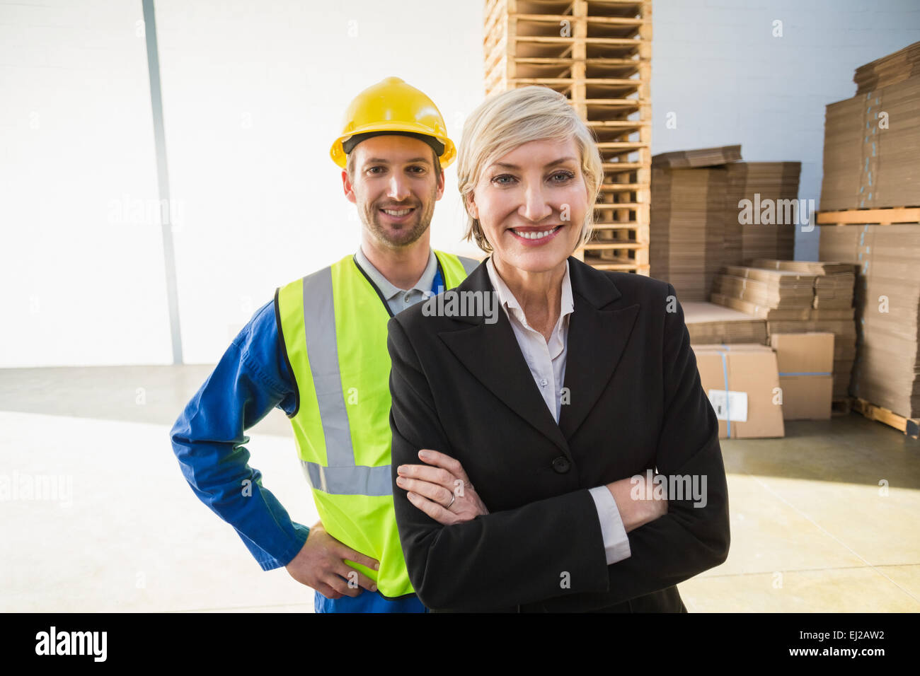 Portrait of smiling warehouse worker and his manager Stock Photo - Alamy