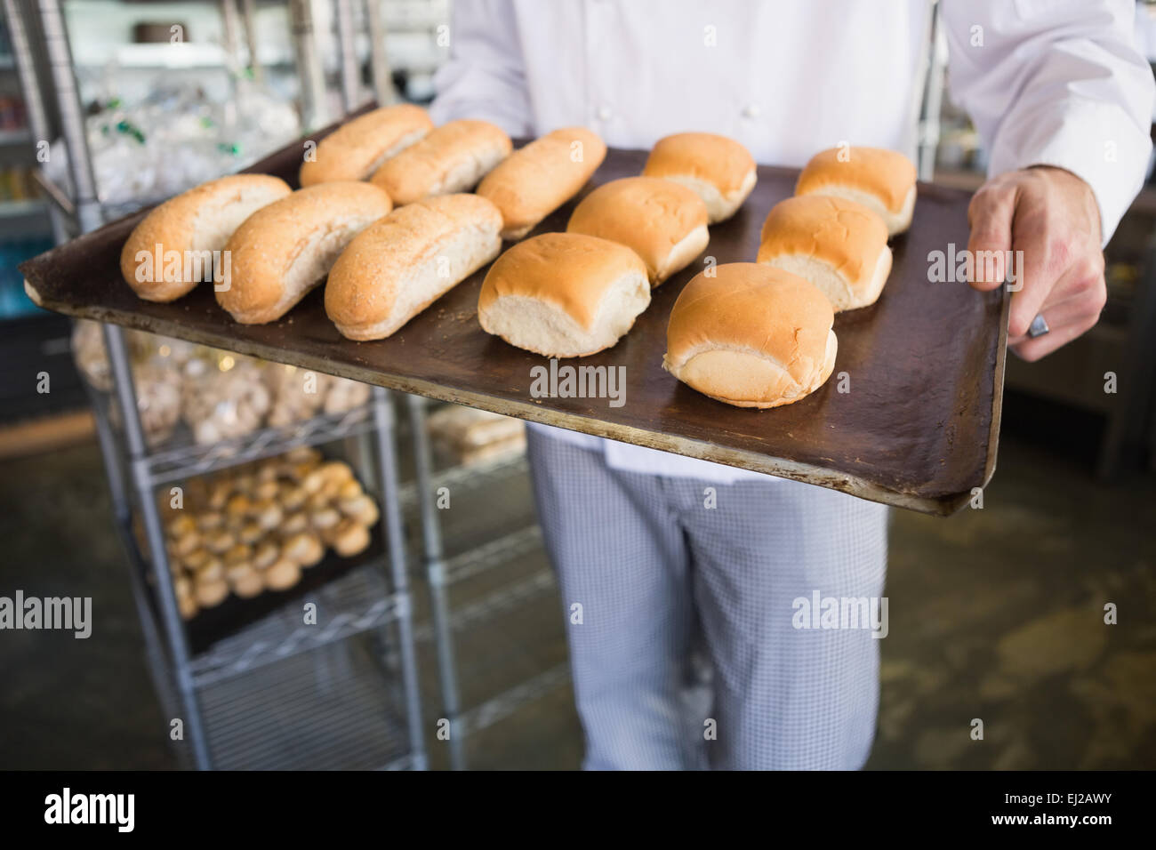 Man holding bread roll hi-res stock photography and images - Alamy