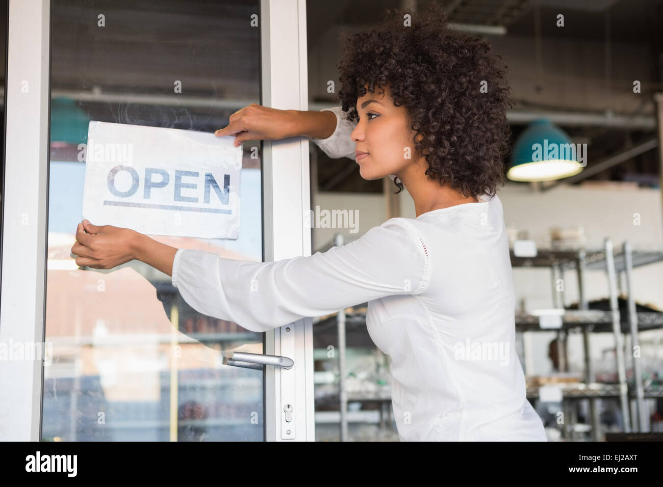 Putting up a sign hi-res stock photography and images - Alamy
