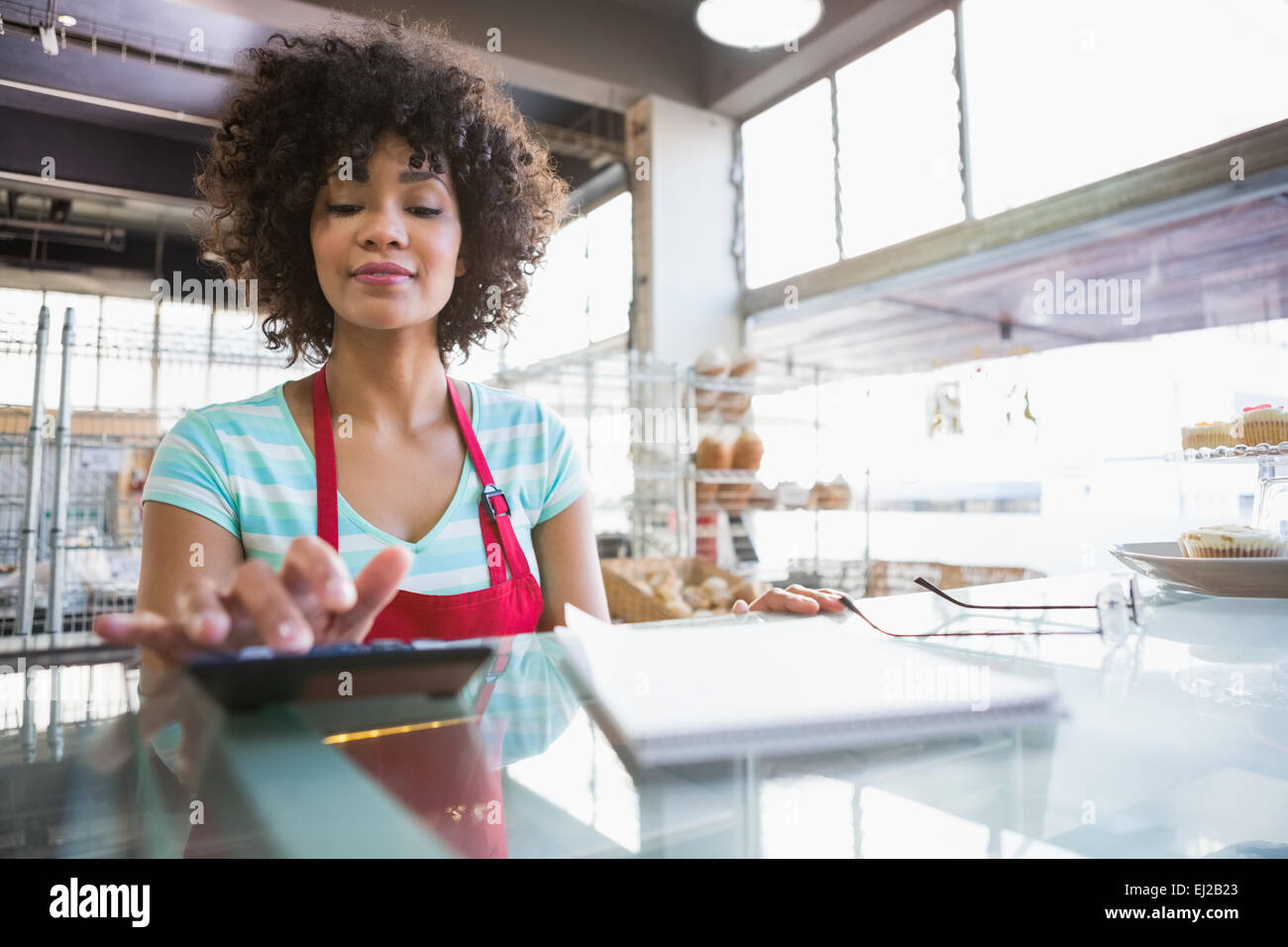 Woman counter female employee hi-res stock photography and images - Alamy