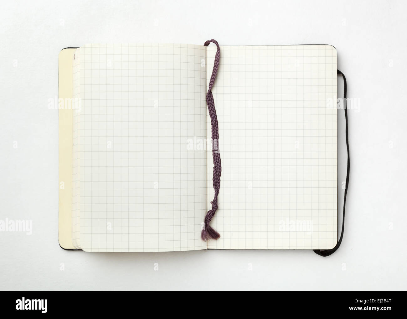 Open notebook on white background Stock Photo - Alamy