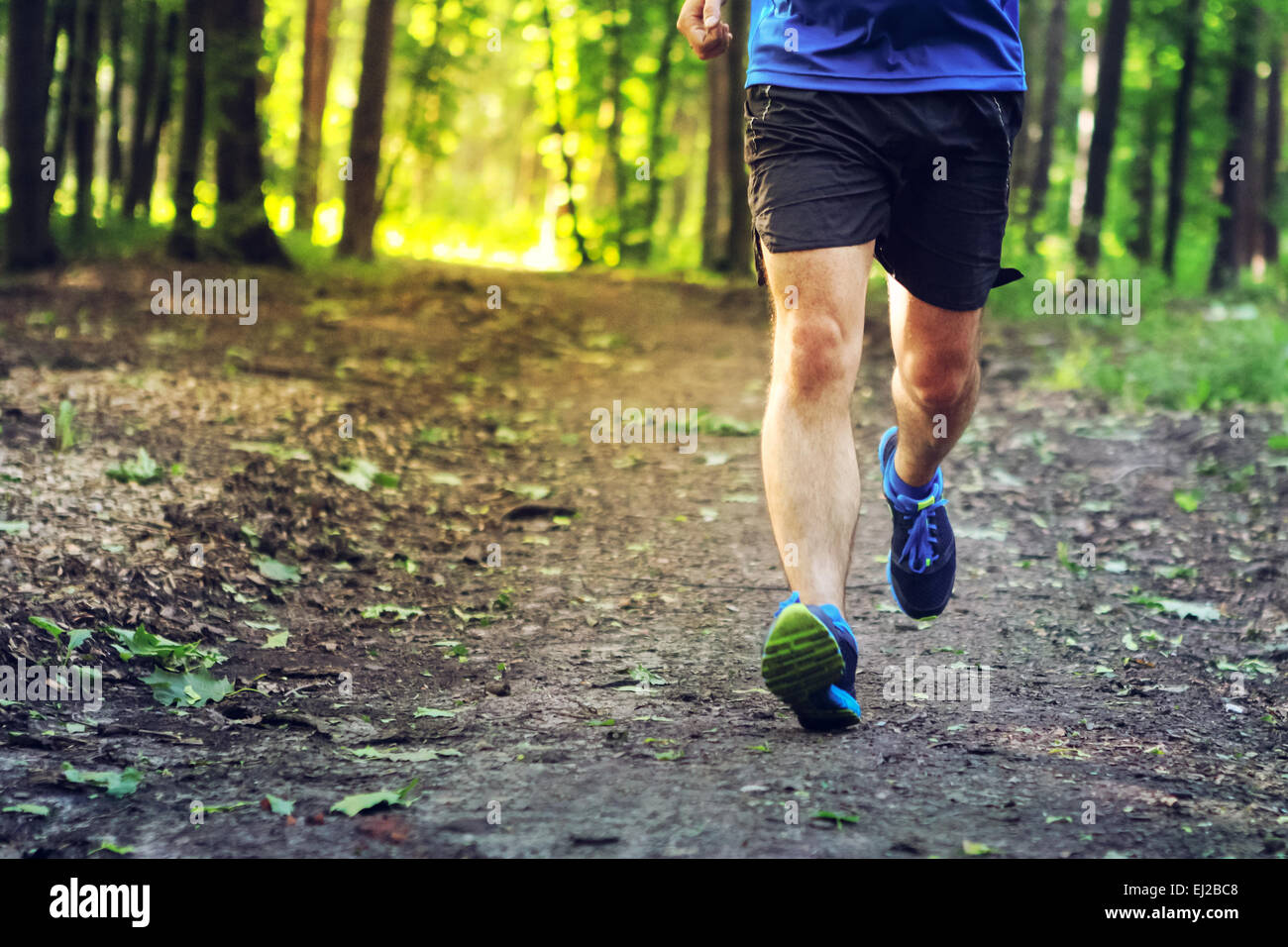 Young man running outdoors in the morning Stock Photo - Alamy
