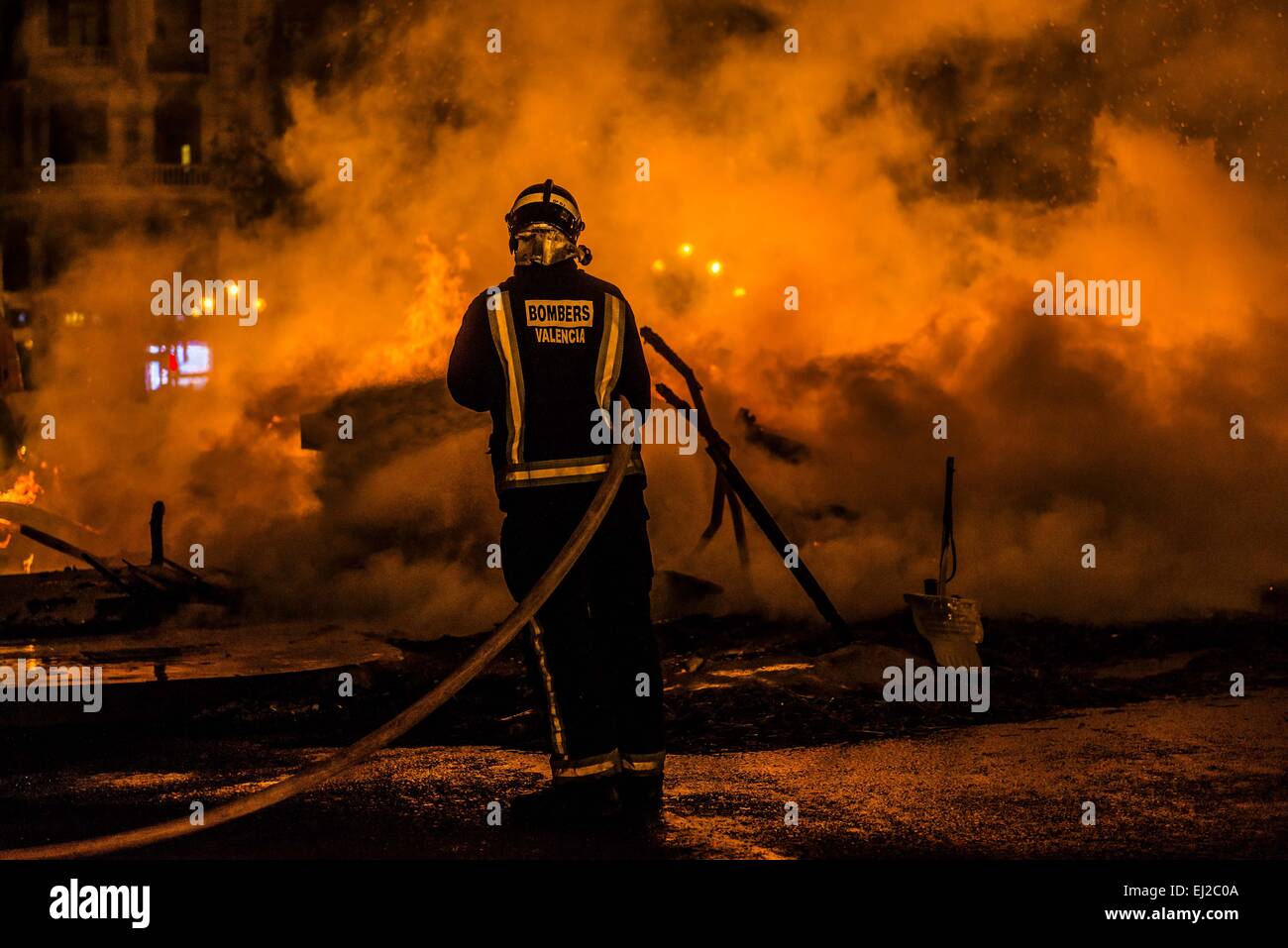 Valencia, Spain. 20th Mar, 2015. Fire fighters control the burning of ...