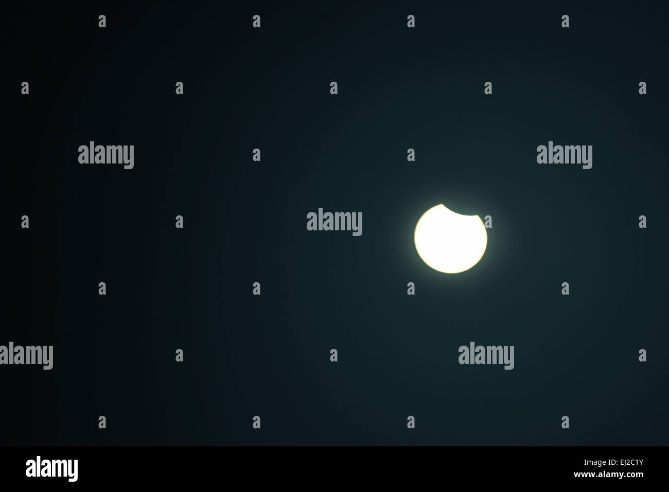 Cairo, Egypt. 20th Mar, 2015. The moon and the sun overlap in a partial ...