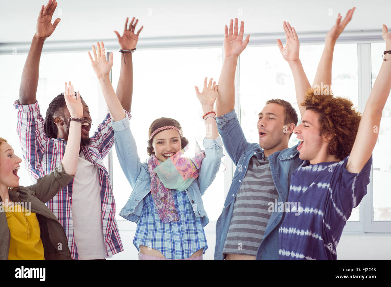 Fashion students cheering together Stock Photo - Alamy