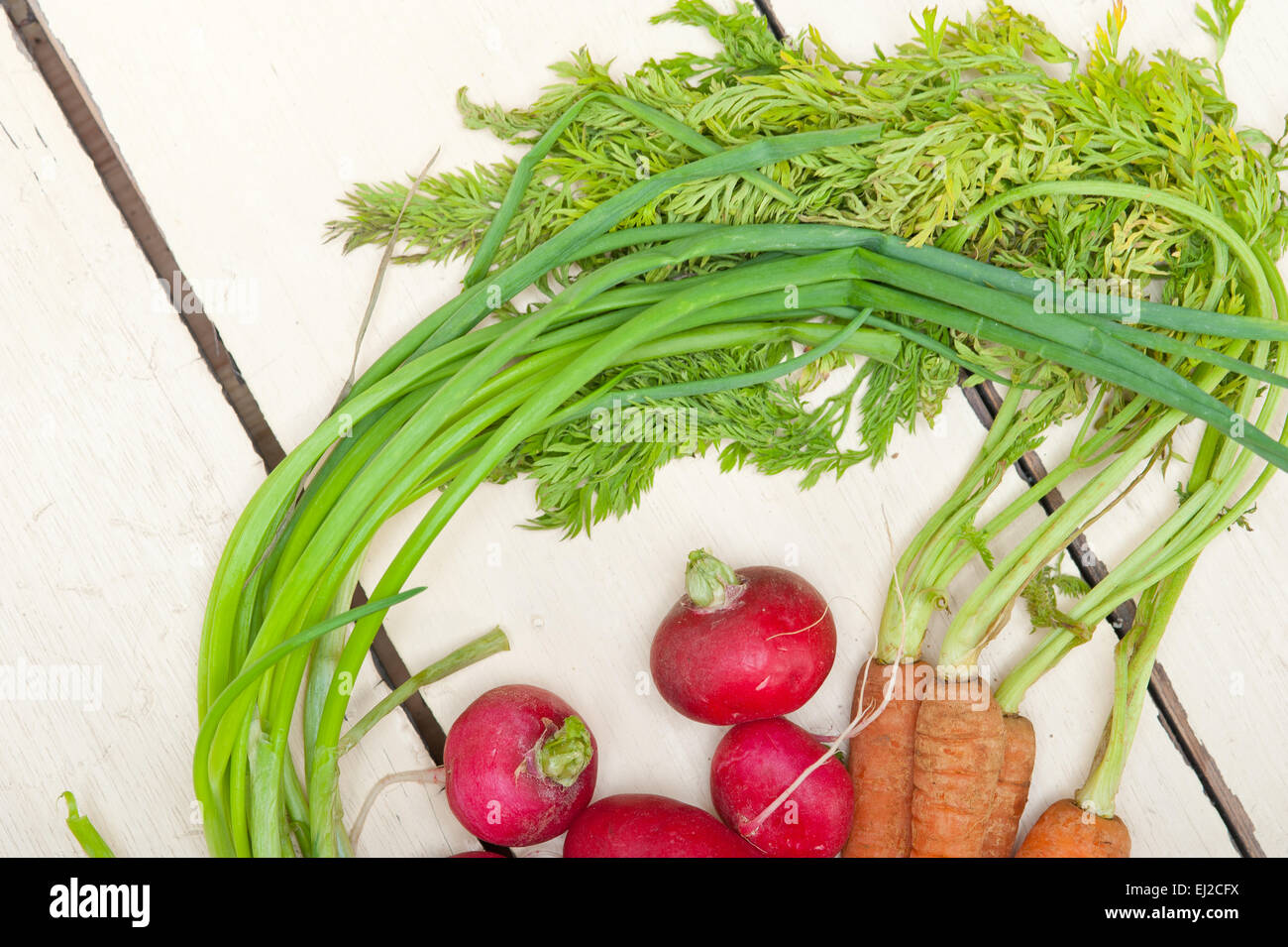 raw root vegetable on a rustic white wood table Stock Photo - Alamy