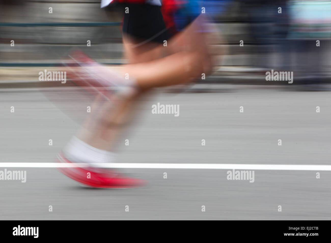 Marathon runner legs closeup - motion blur Stock Photo - Alamy