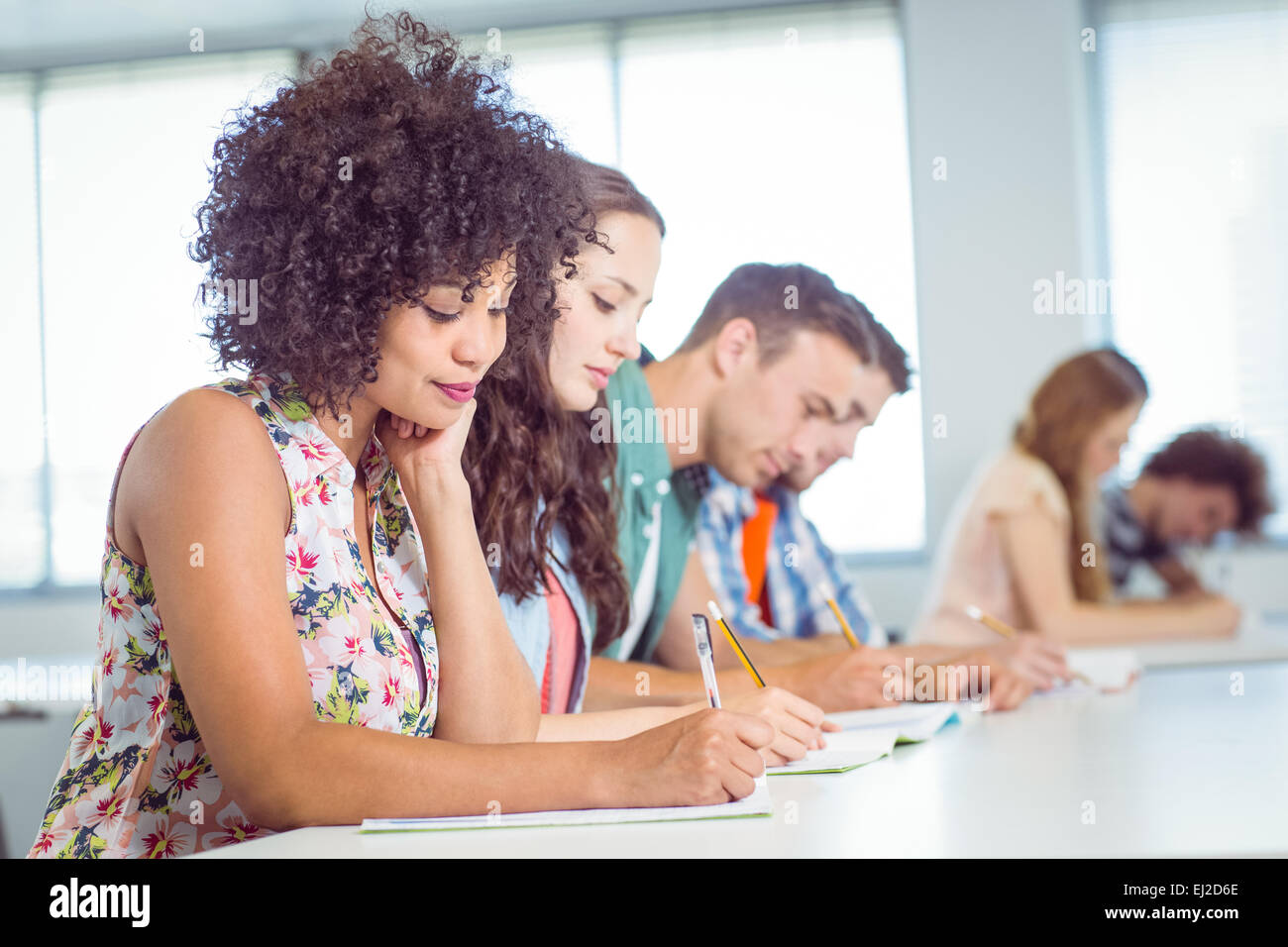 Fashion students taking notes in class Stock Photo - Alamy