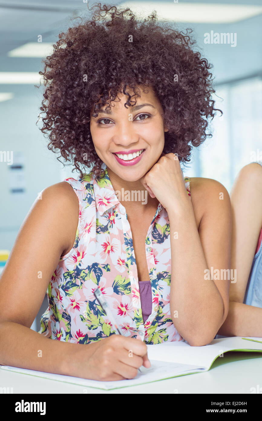 Student taking notes in class Stock Photo - Alamy