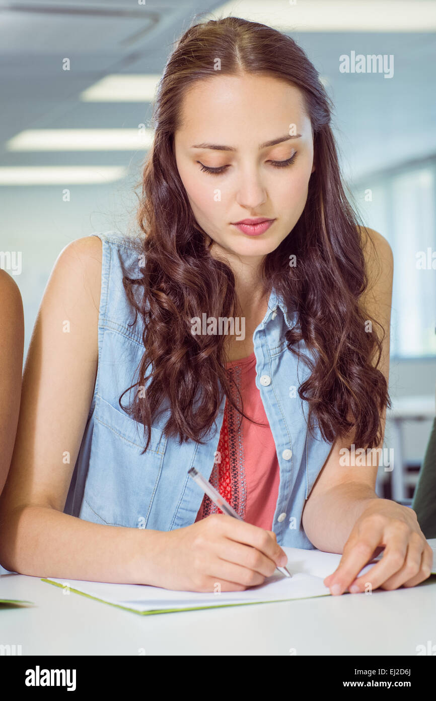 Student taking notes in class Stock Photo - Alamy